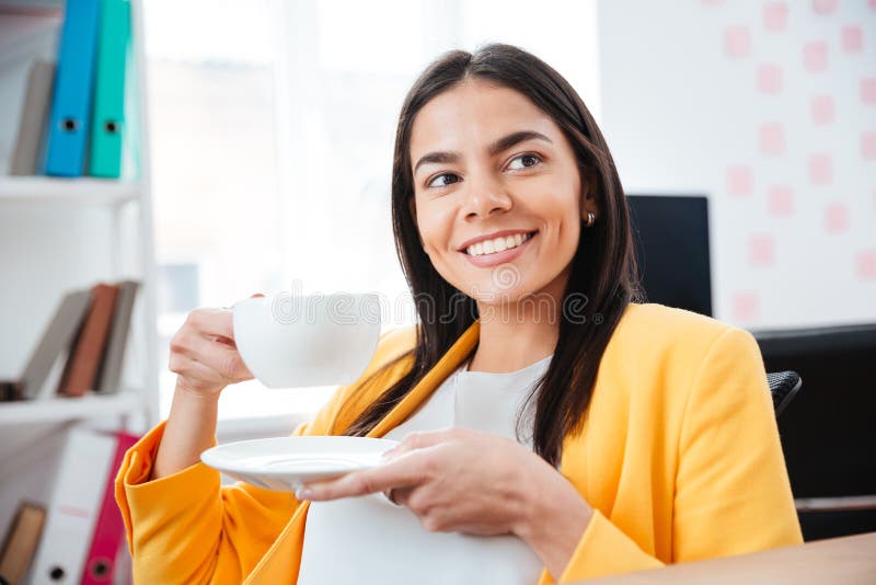Businesswoman Drinking Tea in Office Stock Photo - Image of dressed ...