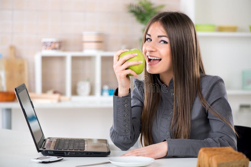 Businesswoman eating apple stock image. Image of people - 38540989