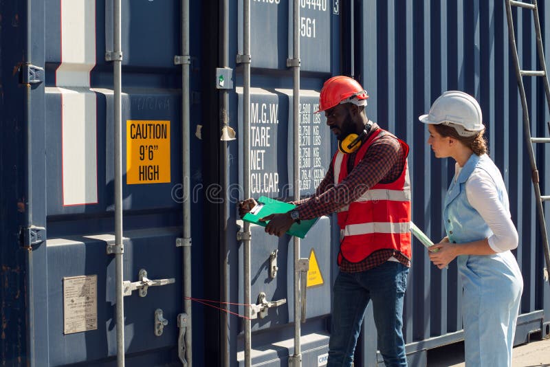 Businesswoman and Engineer Talking and Checking Loading Containers Box ...