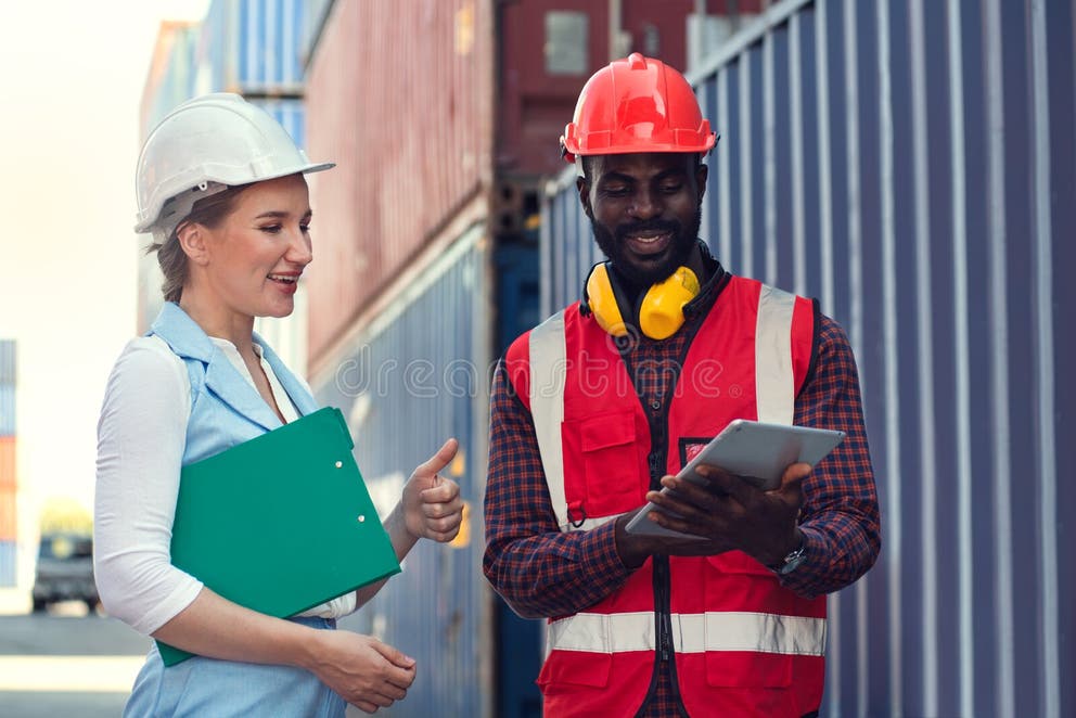 Businesswoman and Engineer Talking and Checking Loading Containers Box ...