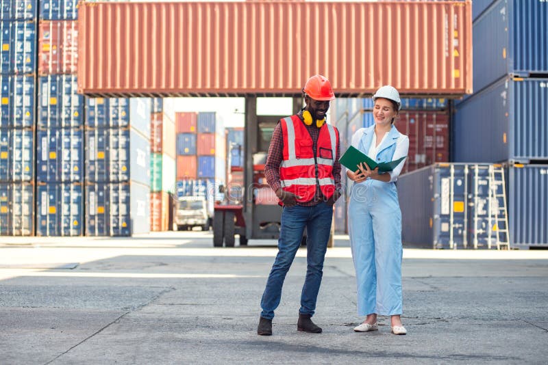 Businesswoman and Engineer Talking and Checking Loading Containers Box ...
