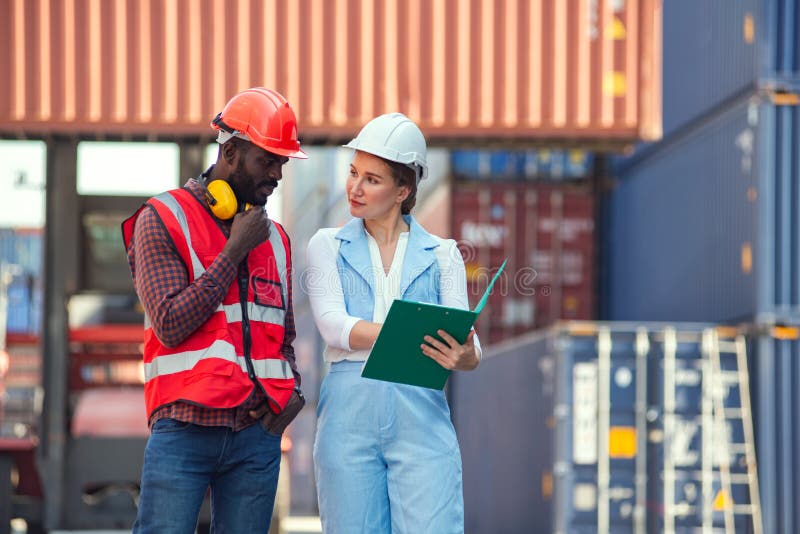 Businesswoman and Engineer Talking and Checking Loading Containers Box ...