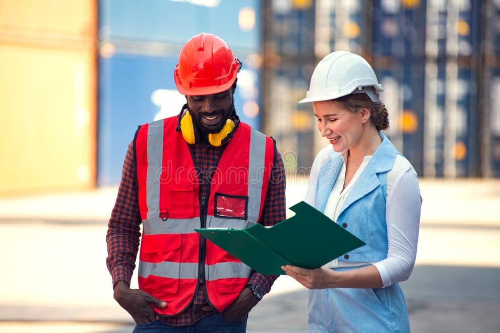 Businesswoman and Engineer Talking and Checking Loading Containers Box ...