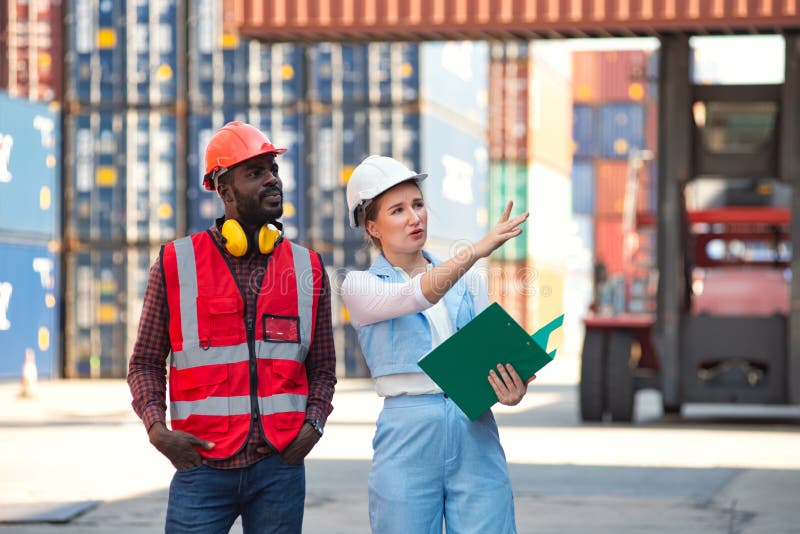 Businesswoman and Engineer Talking and Checking Loading Containers Box ...