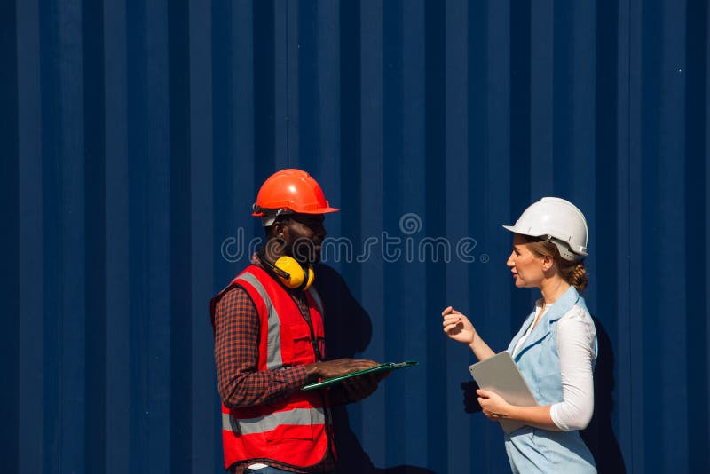Businesswoman and Engineer Talking and Checking Loading Containers Box ...