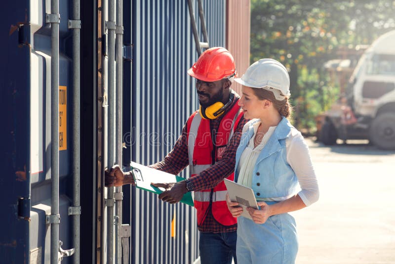 Businesswoman and Engineer Talking and Checking Loading Containers Box ...