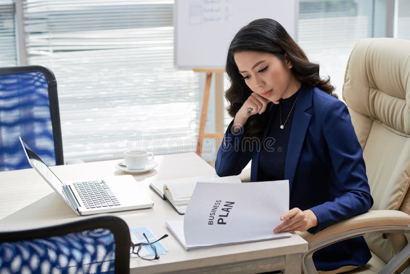 Businesswoman Examining Business Plan Stock Photo - Image of manager ...