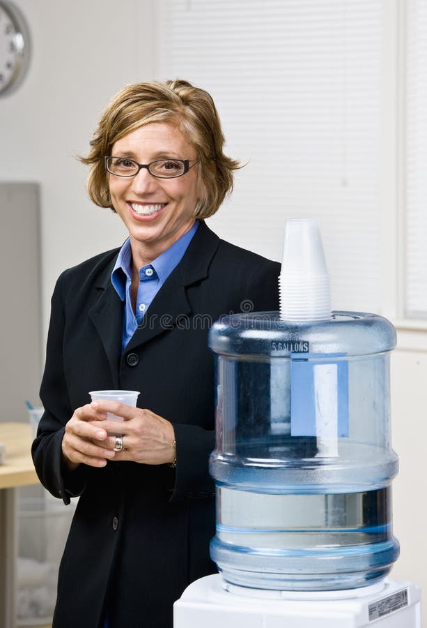 Businesswoman Getting Water Water Cooler Stock Photos - Free & Royalty ...