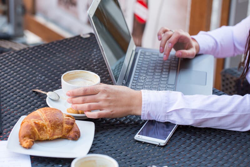 Businesswoman Hands with Laptop and Mobile Phone during Breakfast ...