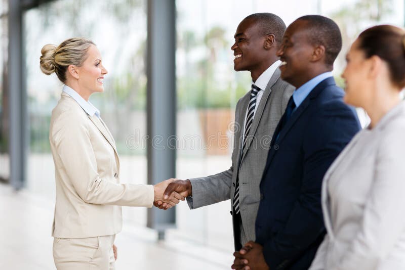 Businesspeople handshaking stock image. Image of happy - 67657495