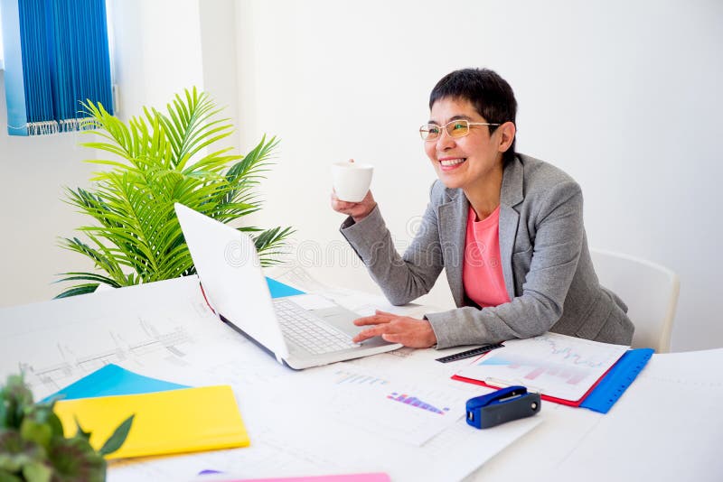 Businesswoman having tea stock image. Image of startup - 97497329
