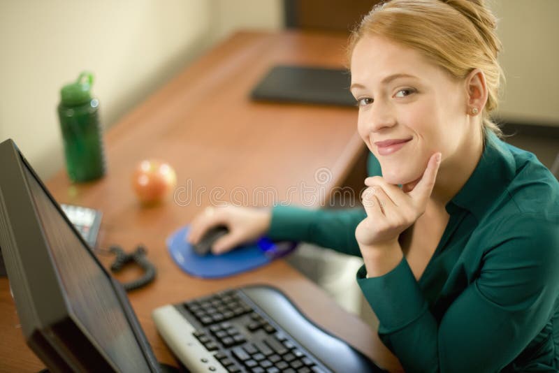 Businesswoman at her desk stock photo. Image of keyboard - 8088972