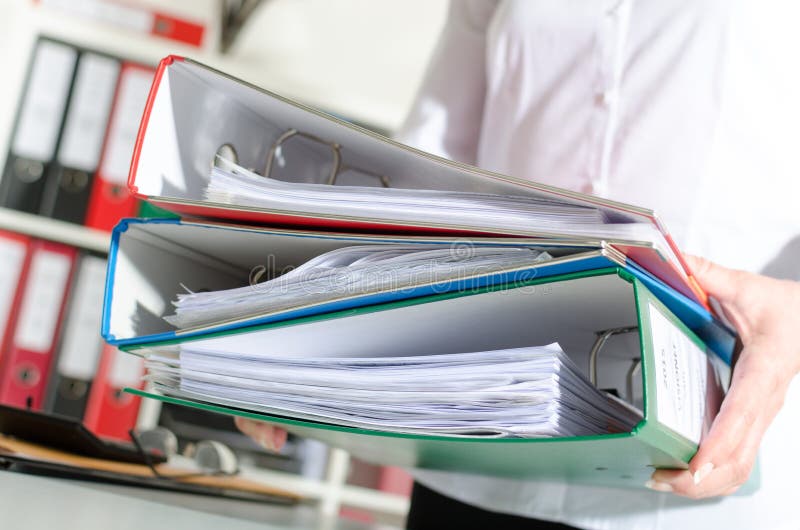 Businesswoman Holding Binders Stock Photo - Image of file, hand: 57564742