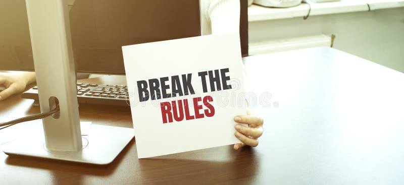Businesswoman Holding a Card with Text Break the Rules Stock Photo ...
