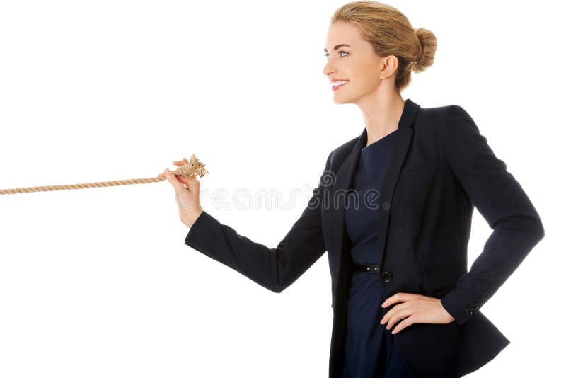 Businesswoman holding rope stock photo. Image of control - 47065746