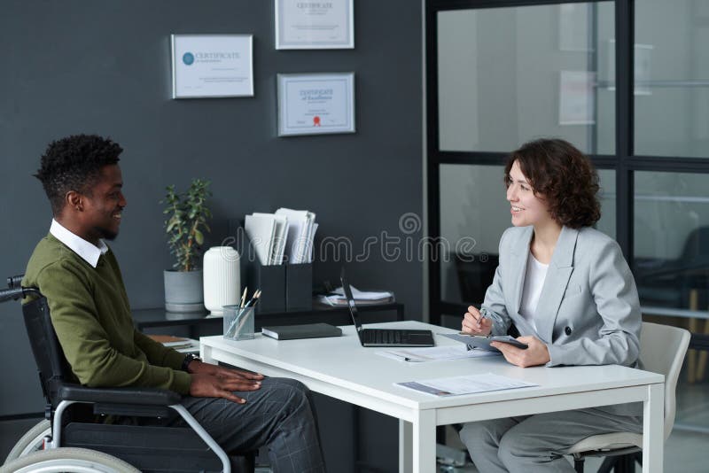 Businesswoman Interviewing Candidate with Disability Stock Photo ...