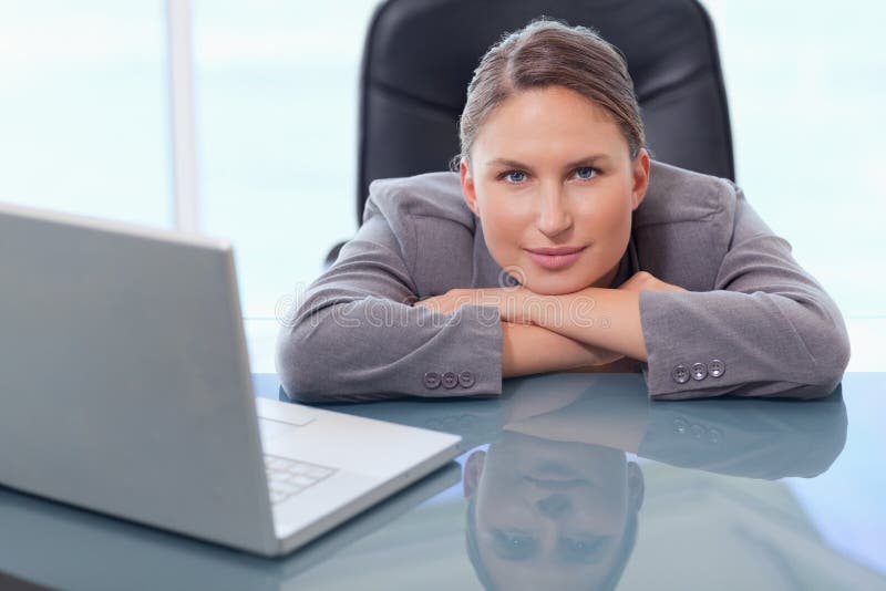 Businesswoman Leaning on Her Desk Stock Image - Image of internet ...