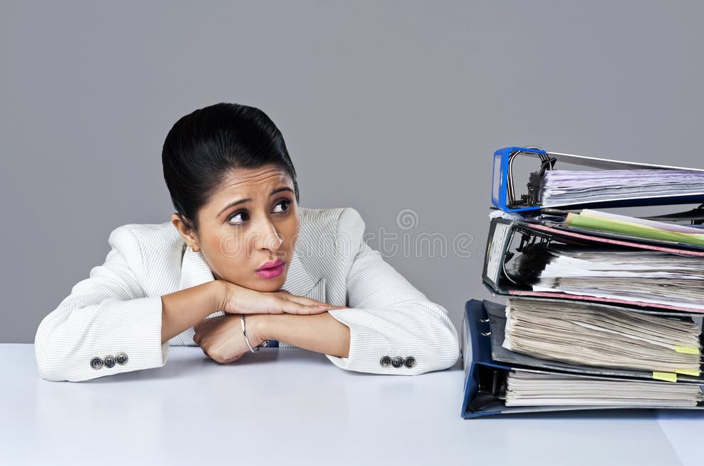 Businesswoman Looking at Files Stock Image - Image of horizontal, away ...