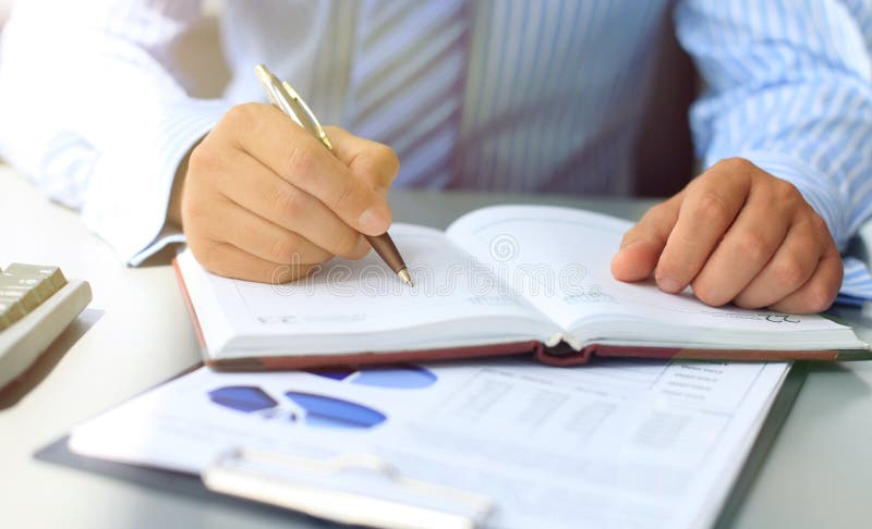 Businesswoman Makes a Note in Notebook. Stock Image - Image of book ...