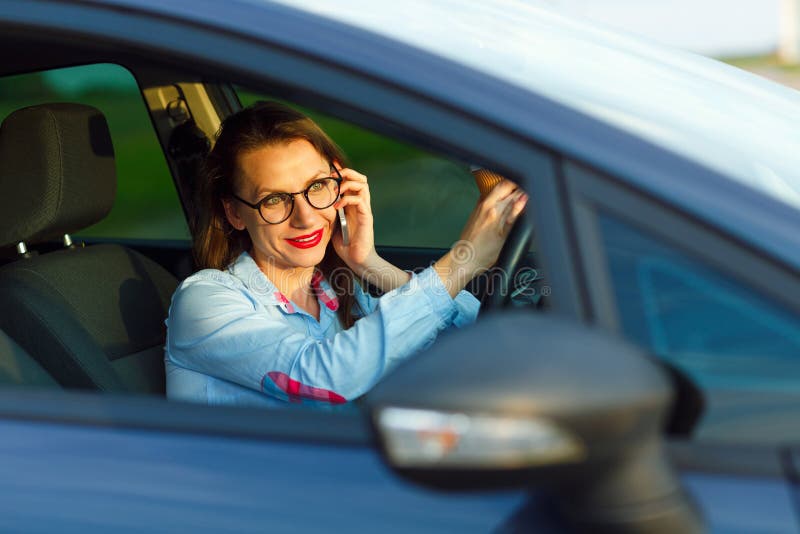 Businesswoman Multitasking while Driving, Drinking Coffee and Ta Stock ...