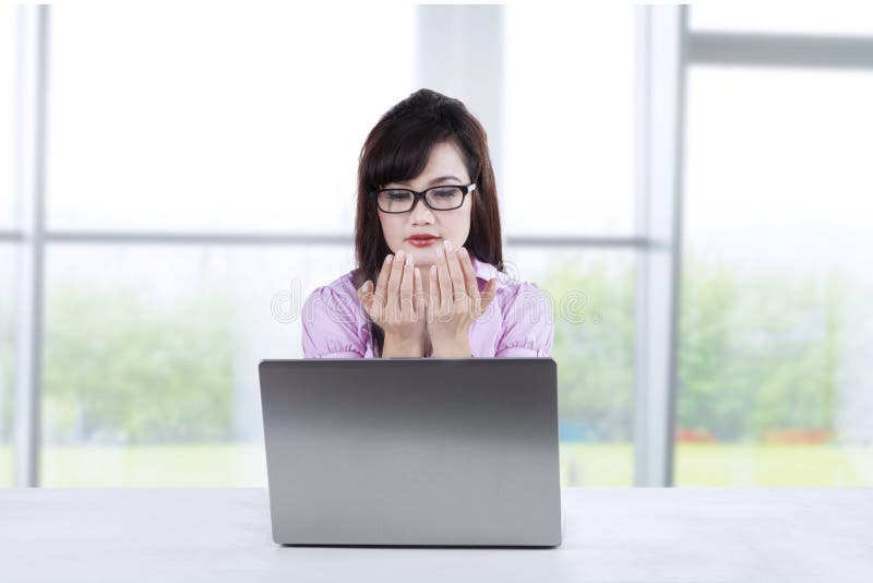 Businesswoman Praying in Office Stock Image - Image of businesswoman ...