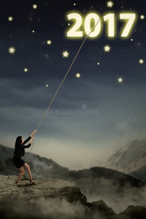 Businesswoman Pulling Number 2017 at the Sky Stock Image - Image of ...