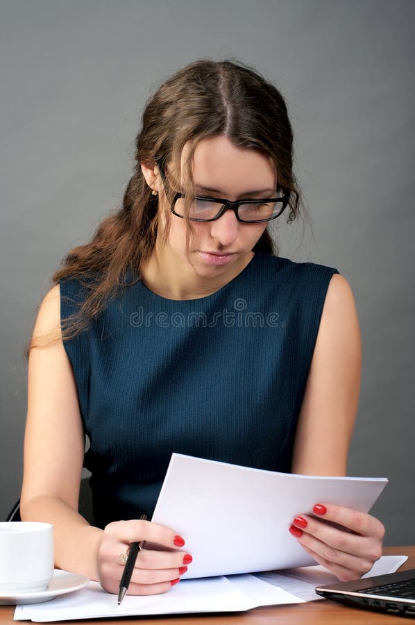 Businesswoman Reading Documents Stock Photo - Image of woman ...
