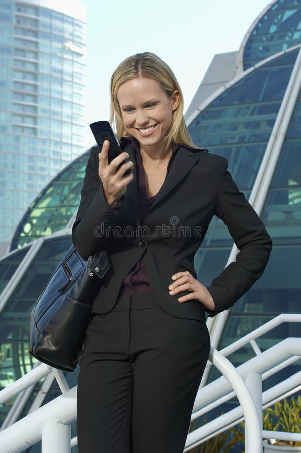 Businesswoman Reading Text Message Stock Photo - Image of professional ...