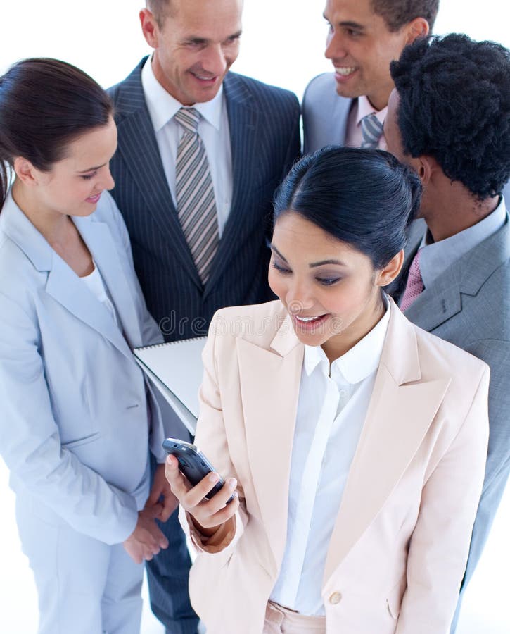 Businessman with Co-workers Text Messaging on Cell Stock Photo - Image ...