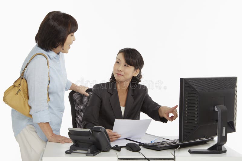 Businesswoman Showing Customer Information on the Computer Screen Stock ...