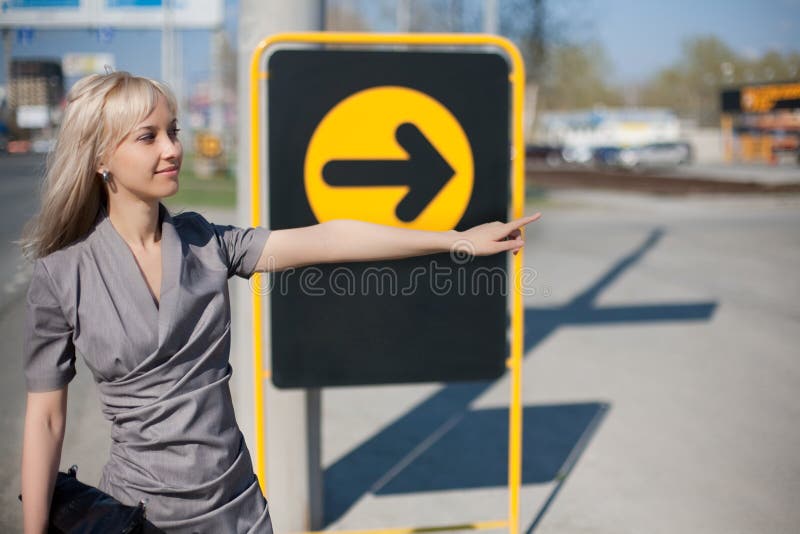 Businesswoman Showing a Direction of Move Stock Photo - Image of face ...