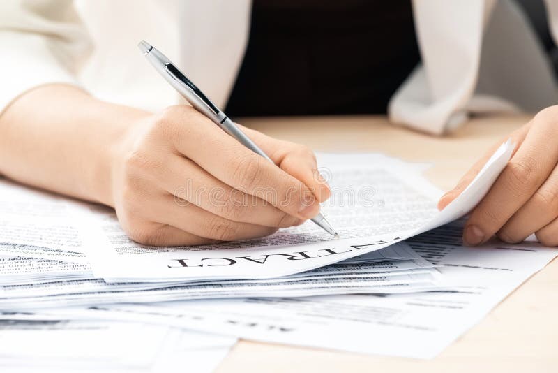 Businesswoman Signing Contract Documents Sitting at Table Stock Photo ...