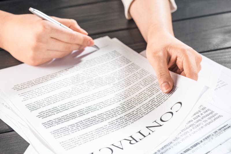 Businesswoman Signing Contract Documents Sitting at Table Stock Photo ...