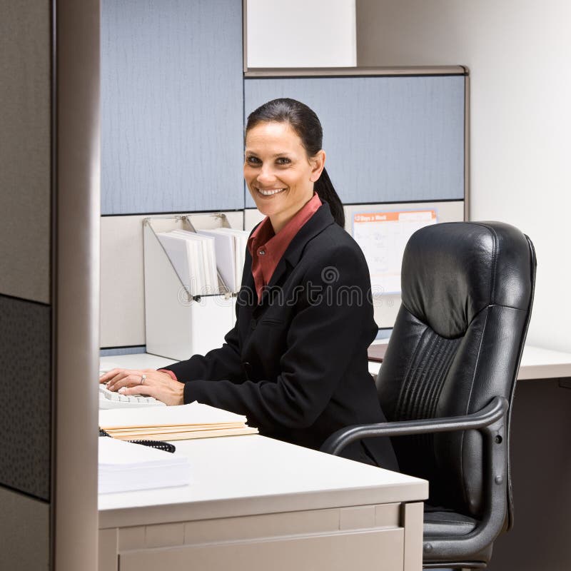 Businesswoman Sitting at Desk Smiling Stock Photo - Image of portrait ...