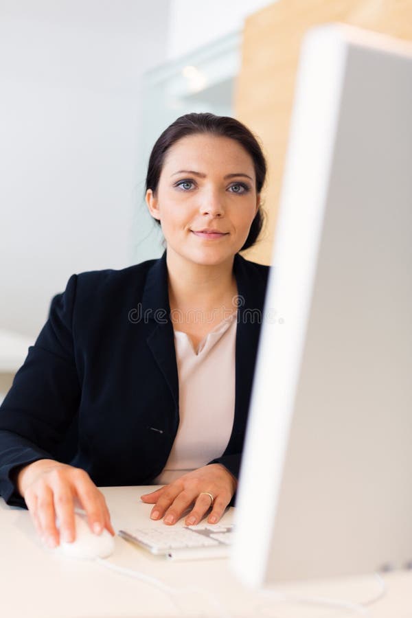 Businesswoman Sitting at Her Desk Stock Photo - Image of secretary ...
