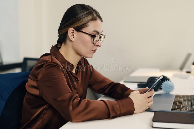 Businesswoman Using Smartphone at Her Workplace Stock Photo - Image of ...