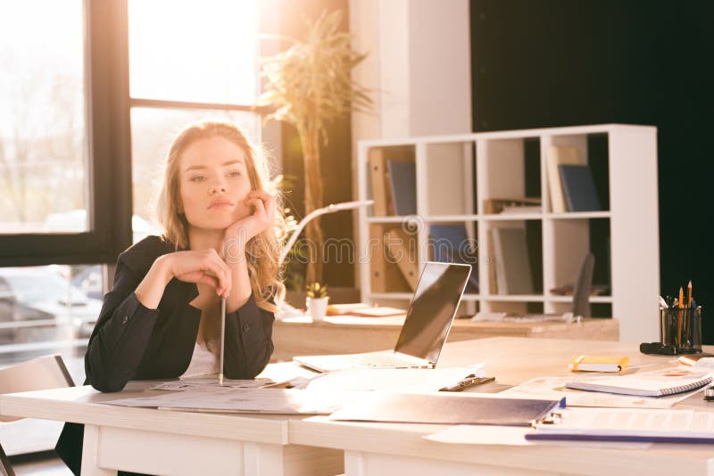 Businesswoman Sitting at Workplace and Working Alone in Office Stock ...