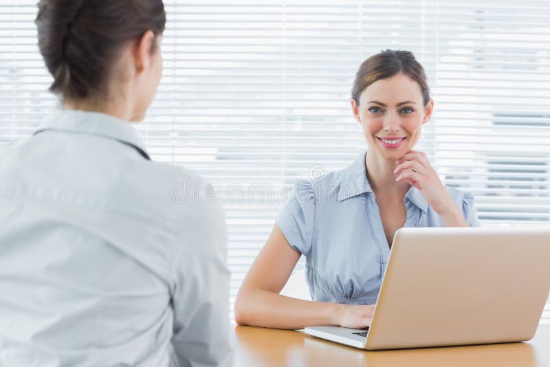 Businesswoman Smiling at Camera during an Interview Stock Photo - Image ...