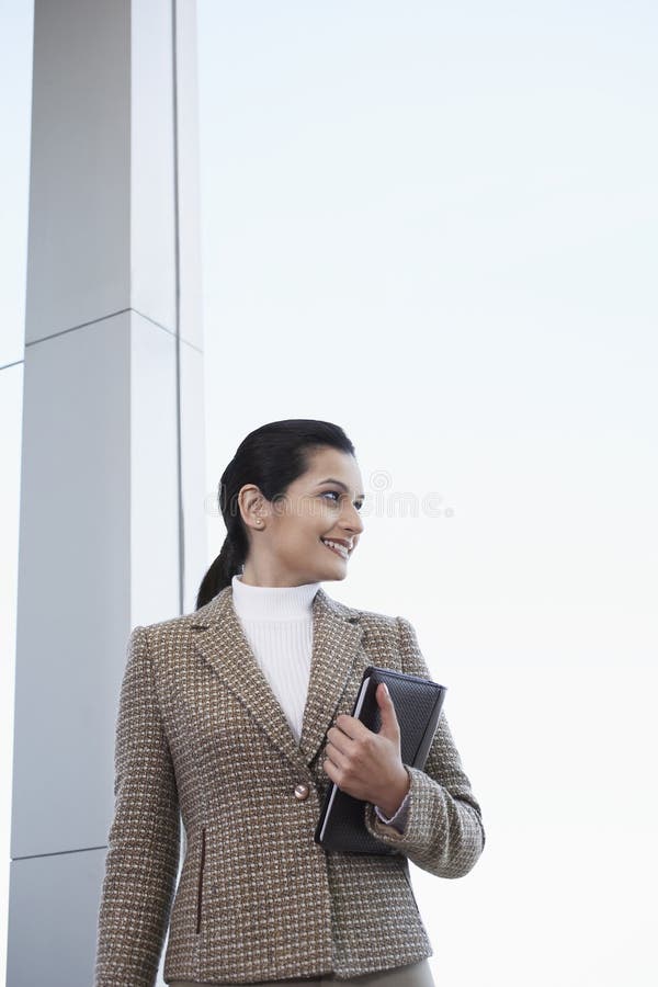 Businesswoman Smiling in Office Stock Image - Image of adult, copyspace ...