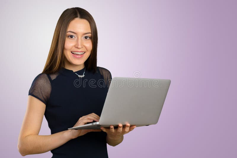 Businesswoman Standing with Laptop Stock Image - Image of looking ...