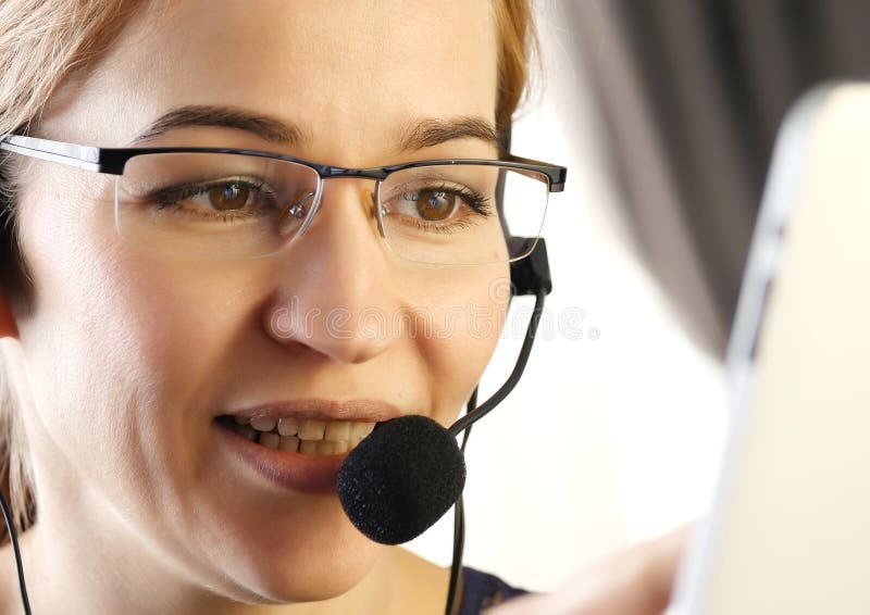 Businesswoman Talking on a Headset in an Office. Customer Service ...