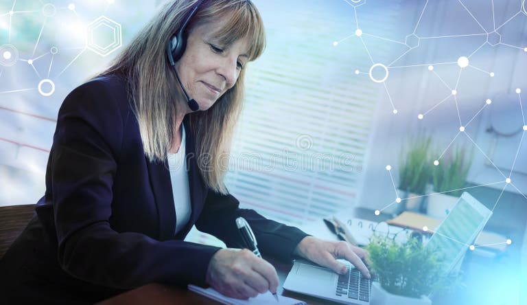 Businesswoman Talking on a Headset and Taking Notes Light Effect Stock ...