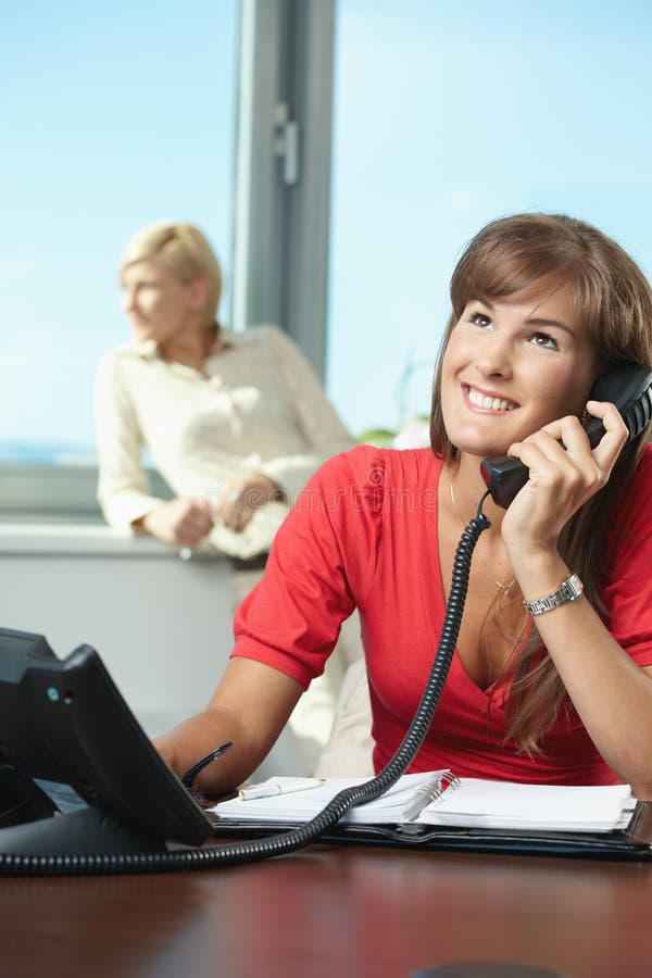 Businesswoman Talking on Landline Phone Stock Image - Image of ...