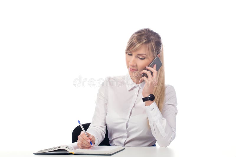 Businesswoman Talking on the Phone and Taking Notes. Stock Image ...