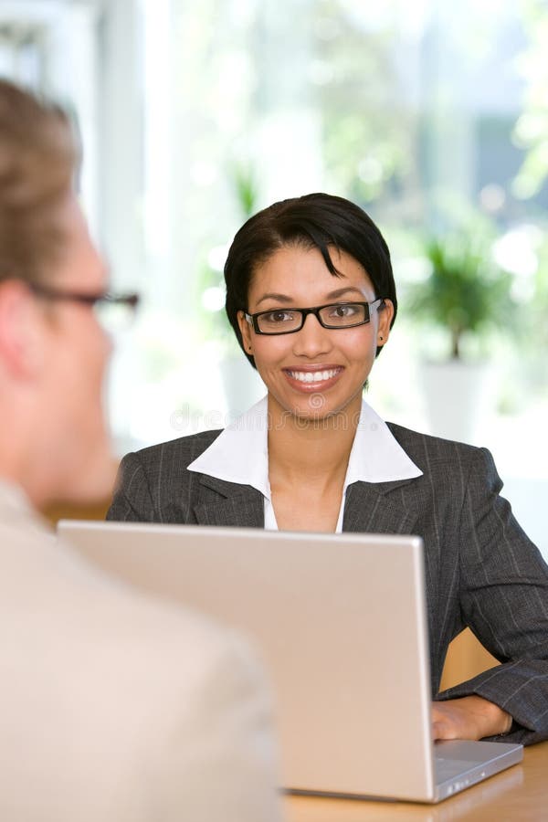 Businesswoman Talking To Client Stock Photo - Image of laptop ...