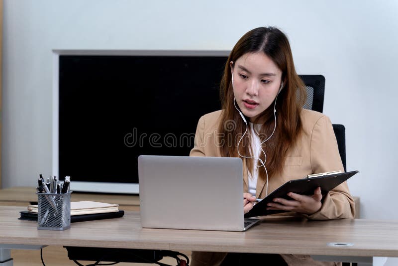 Businesswoman Thinking and Using Computer Working in Office for ...
