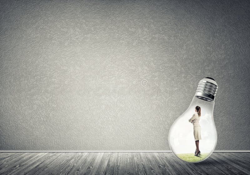 Businesswoman Trapped in Bulb Stock Photo - Image of wall, motivation ...