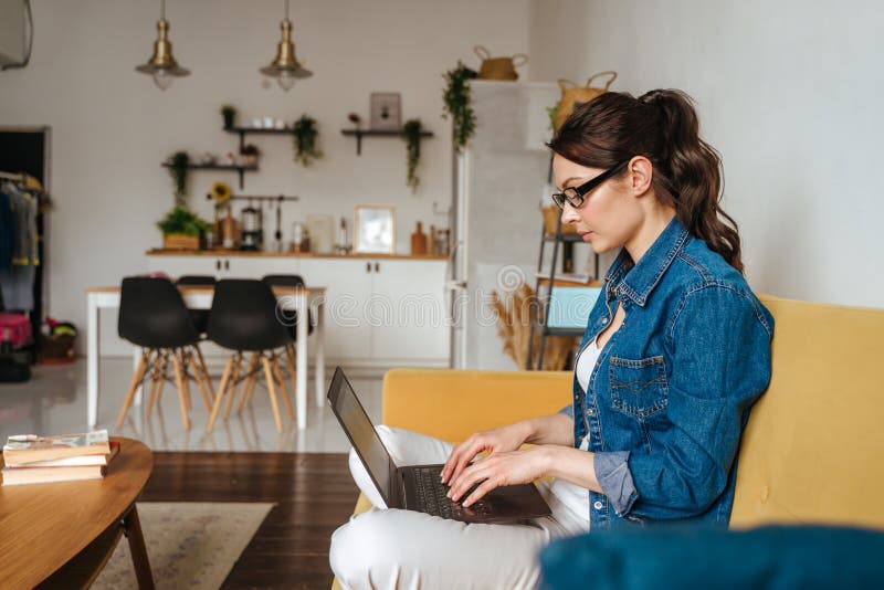 Businesswoman Typing an E-mail on Laptop at Home Office. Stock Image ...