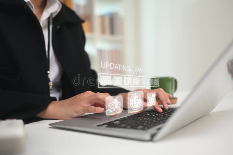 Businesswoman Typing on Laptop with Virtual Display Showing Updating ...