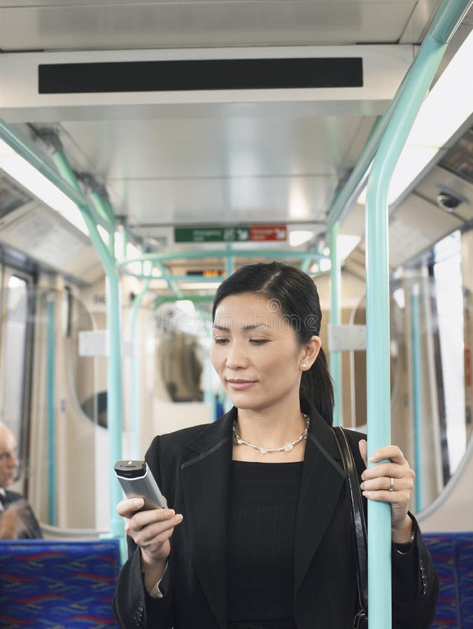 Businesswoman Using Cellphone in Train Stock Photo - Image of career ...